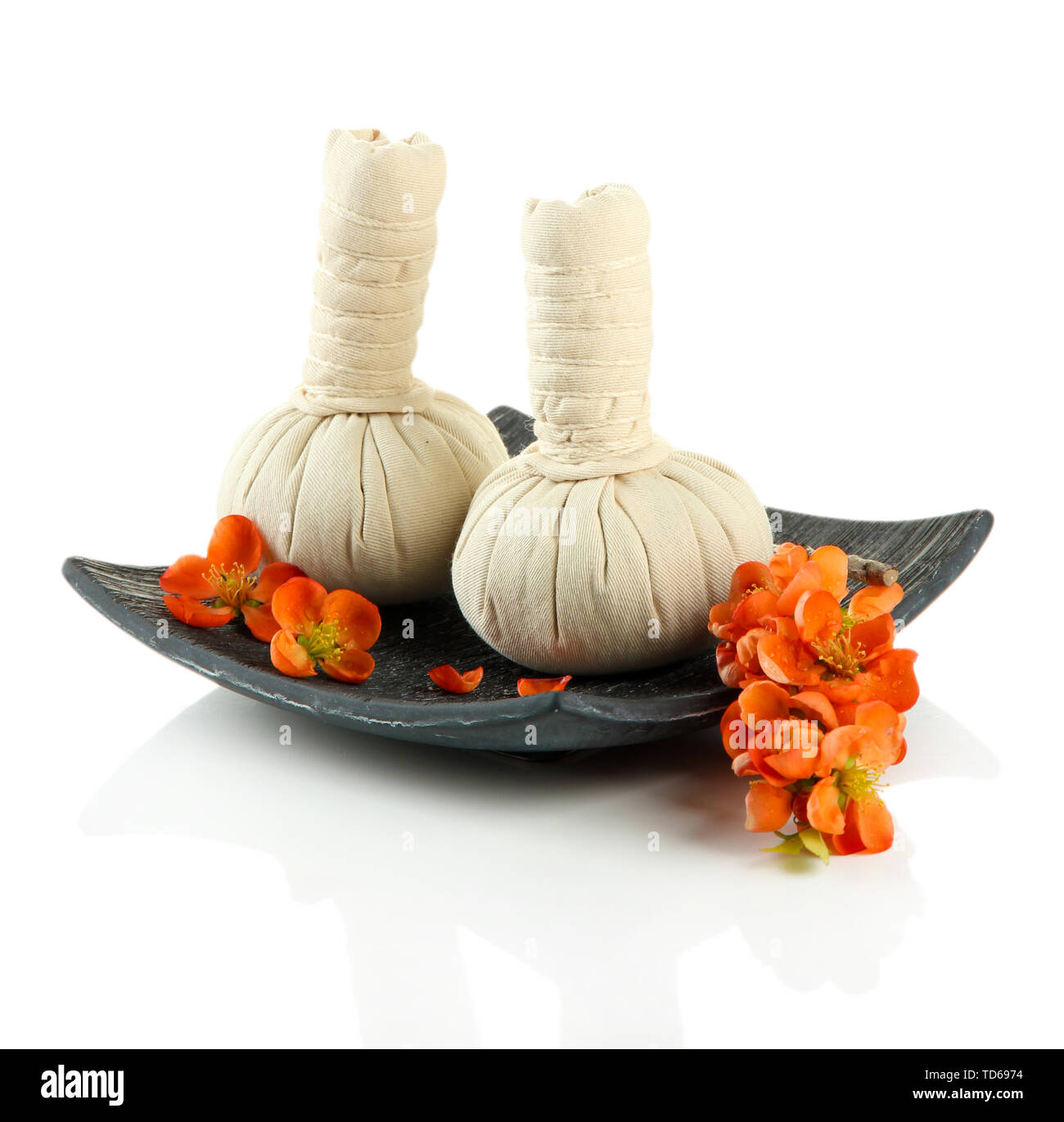 Herbal compress balls for spa treatment and flowers isolated on white ...