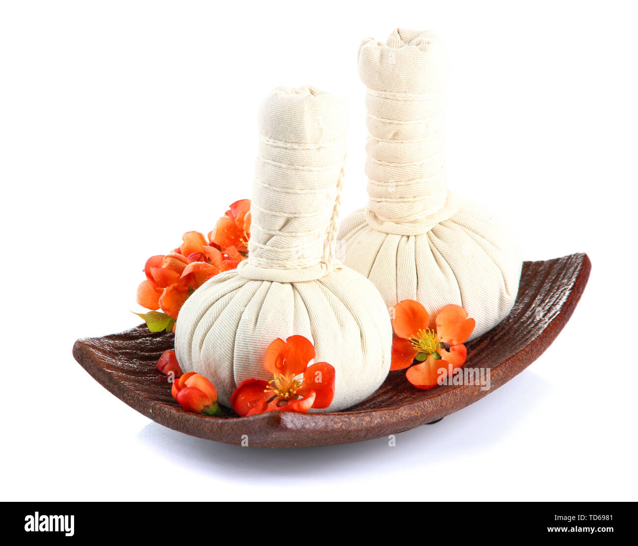 Herbal compress balls for spa treatment and flowers isolated on white ...