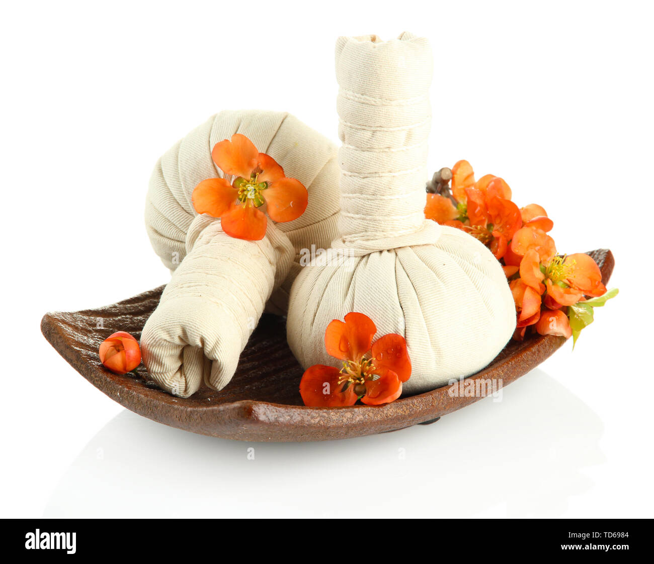Herbal compress balls for spa treatment and flowers isolated on white ...