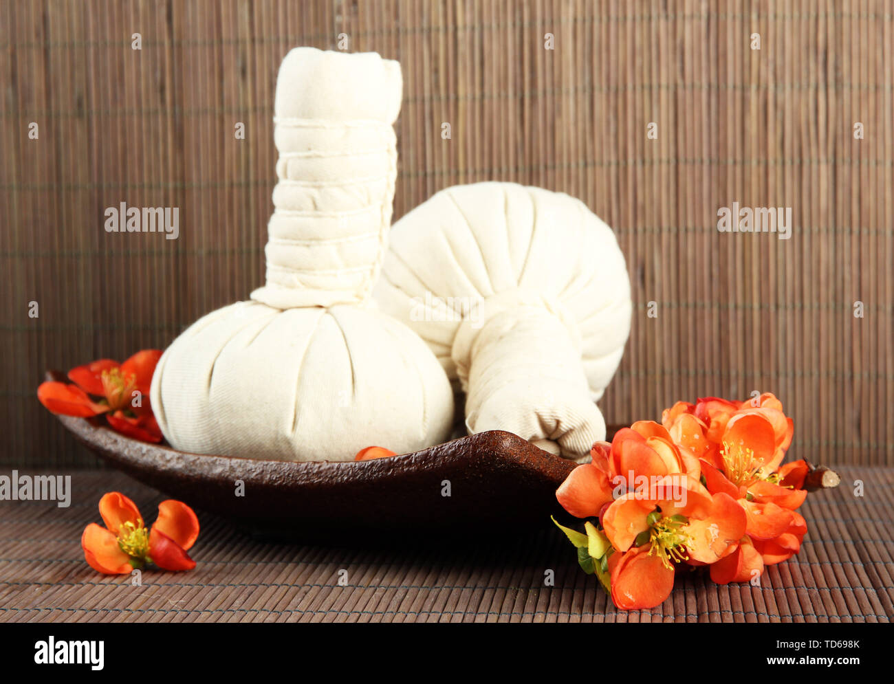 Herbal compress balls for spa treatment on bamboo background Stock ...