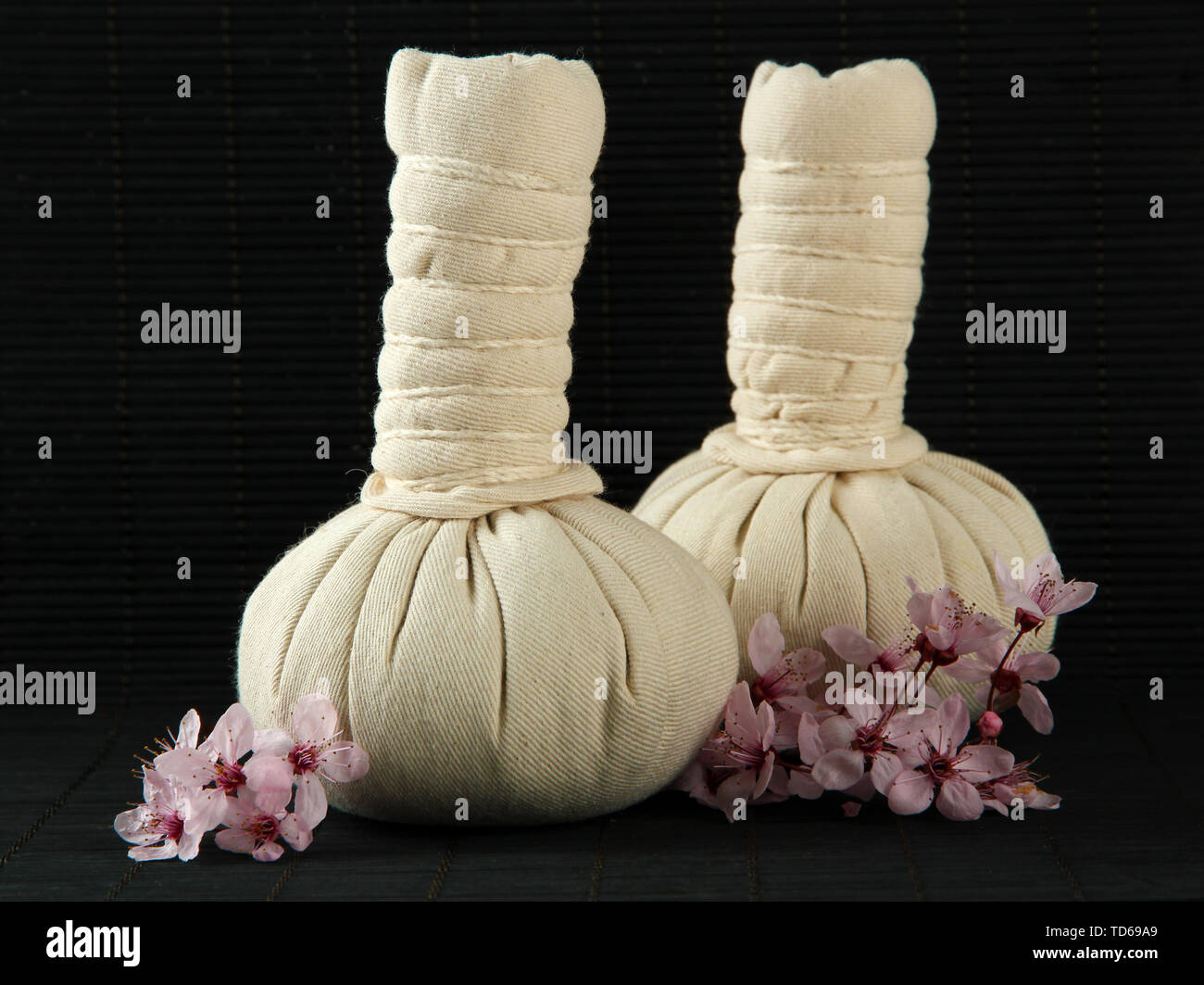 Herbal compress balls for spa treatment on bamboo background Stock ...
