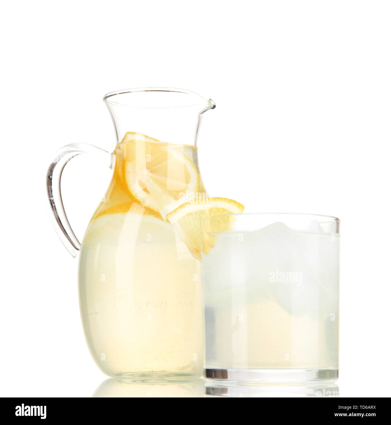 Lemonade in pitcher and glass isolated on white Stock Photo - Alamy