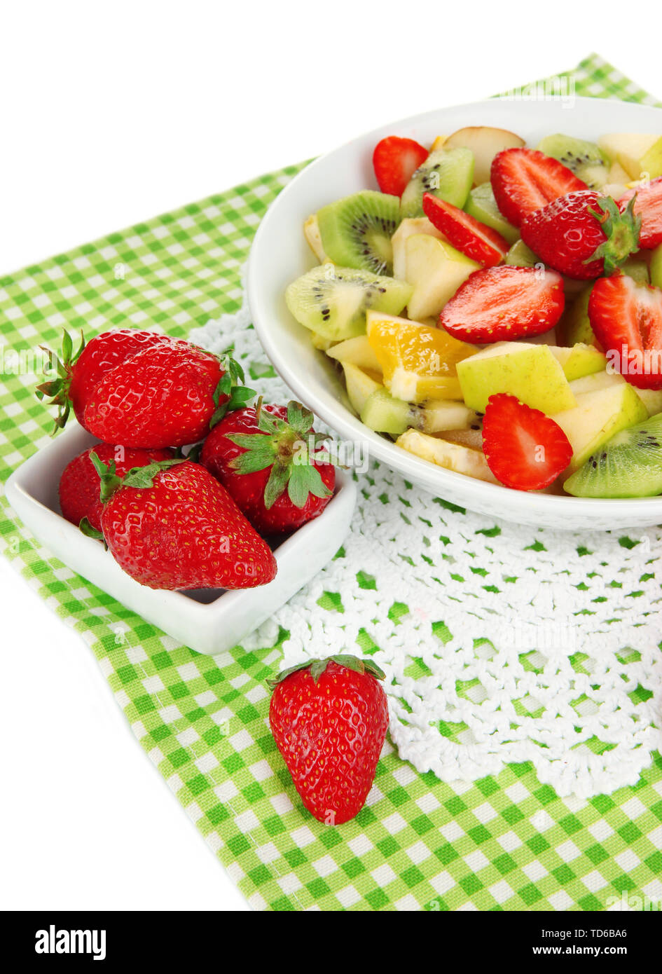 Useful fruit salad of fresh fruits and berries in bowl isolated on ...