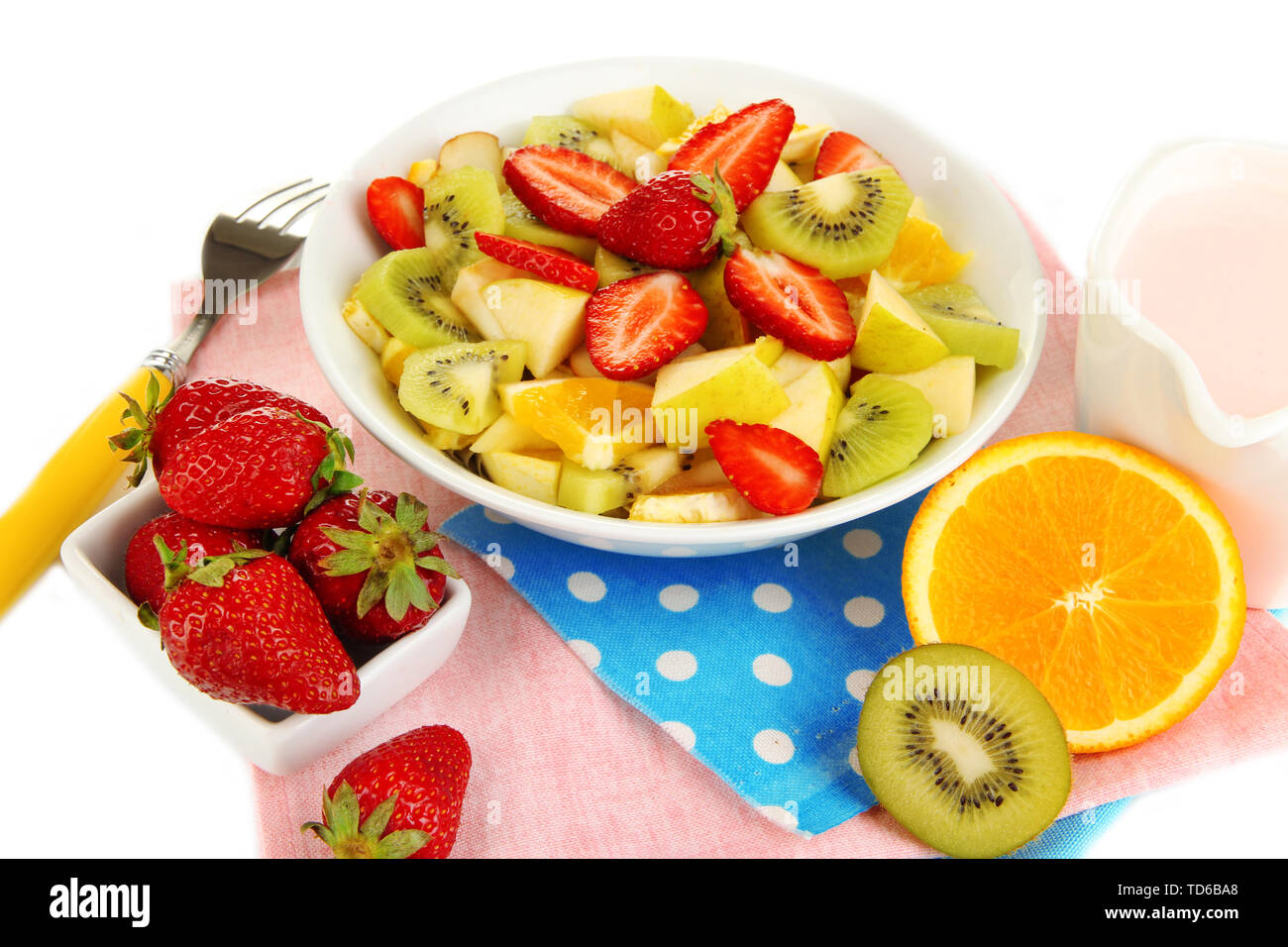 Useful fruit salad of fresh fruits and berries in bowl isolated on ...
