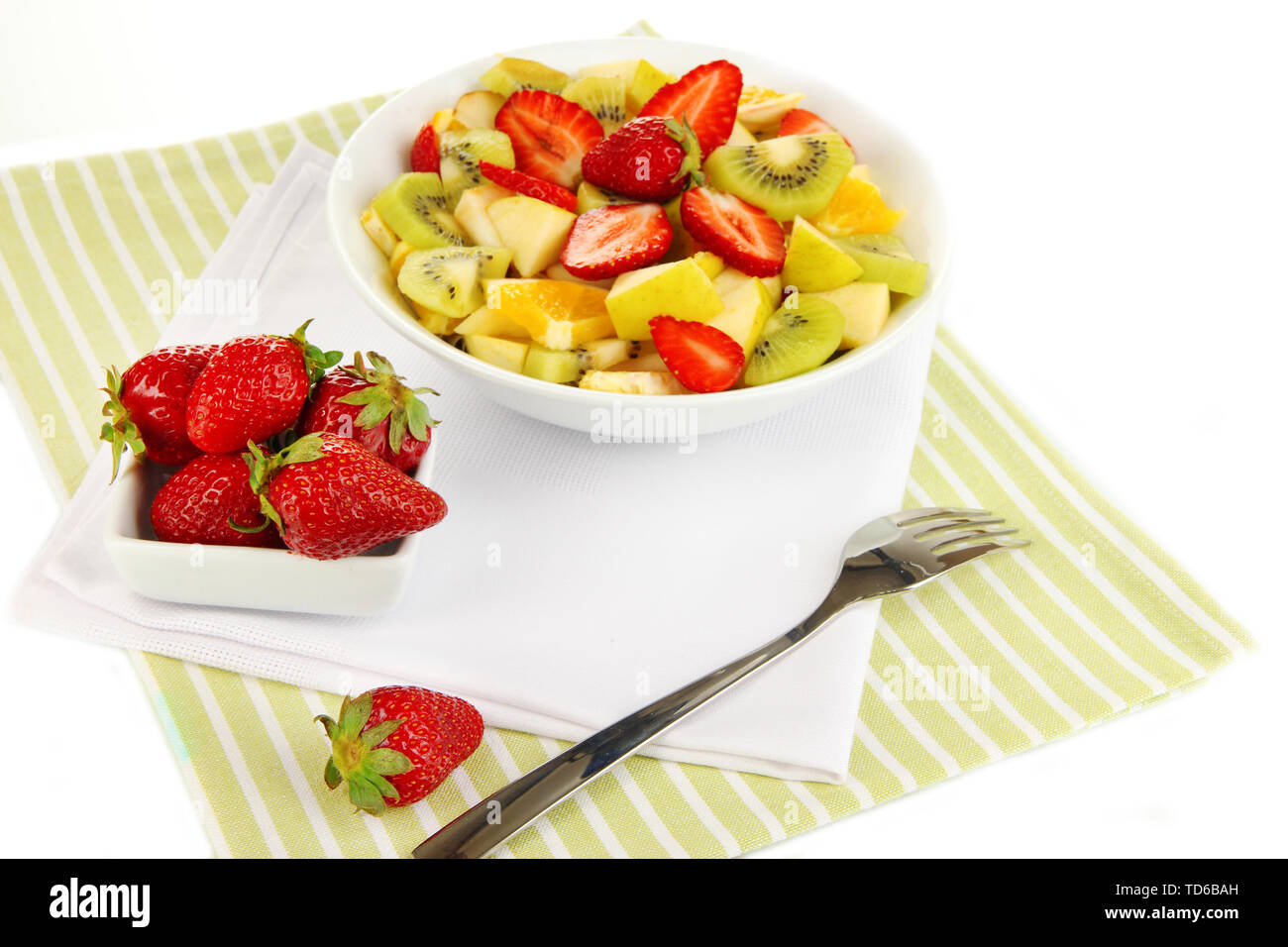 Useful fruit salad of fresh fruits and berries in bowl isolated on ...