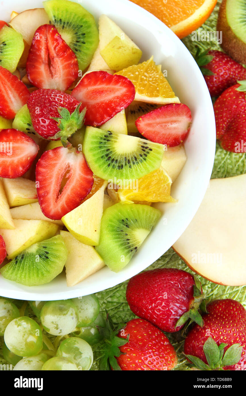 Useful fruit salad of fresh fruits and berries in bowl close-up Stock ...
