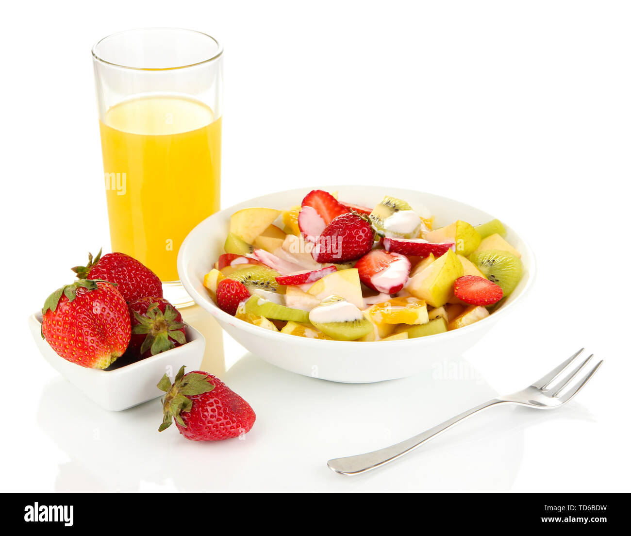 Useful fruit salad of fresh fruits and berries in bowl isolated on ...