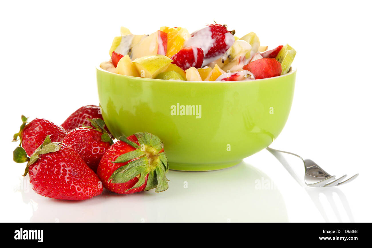 Useful fruit salad of fresh fruits and berries in bowl isolated on ...
