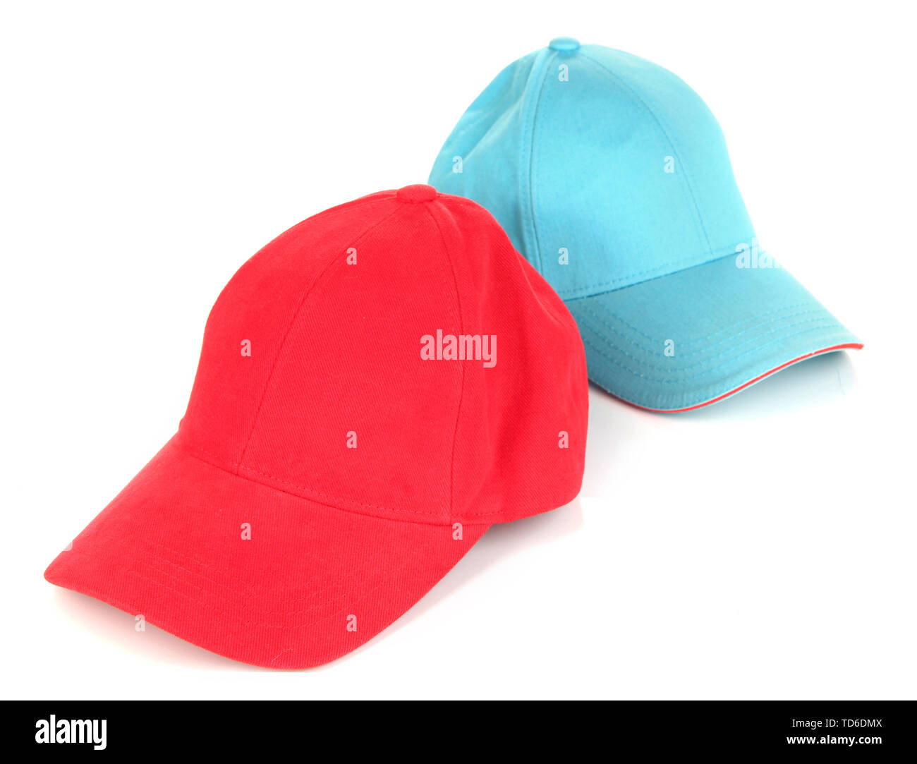 Red and blue caps cap isolated on white Stock Photo - Alamy