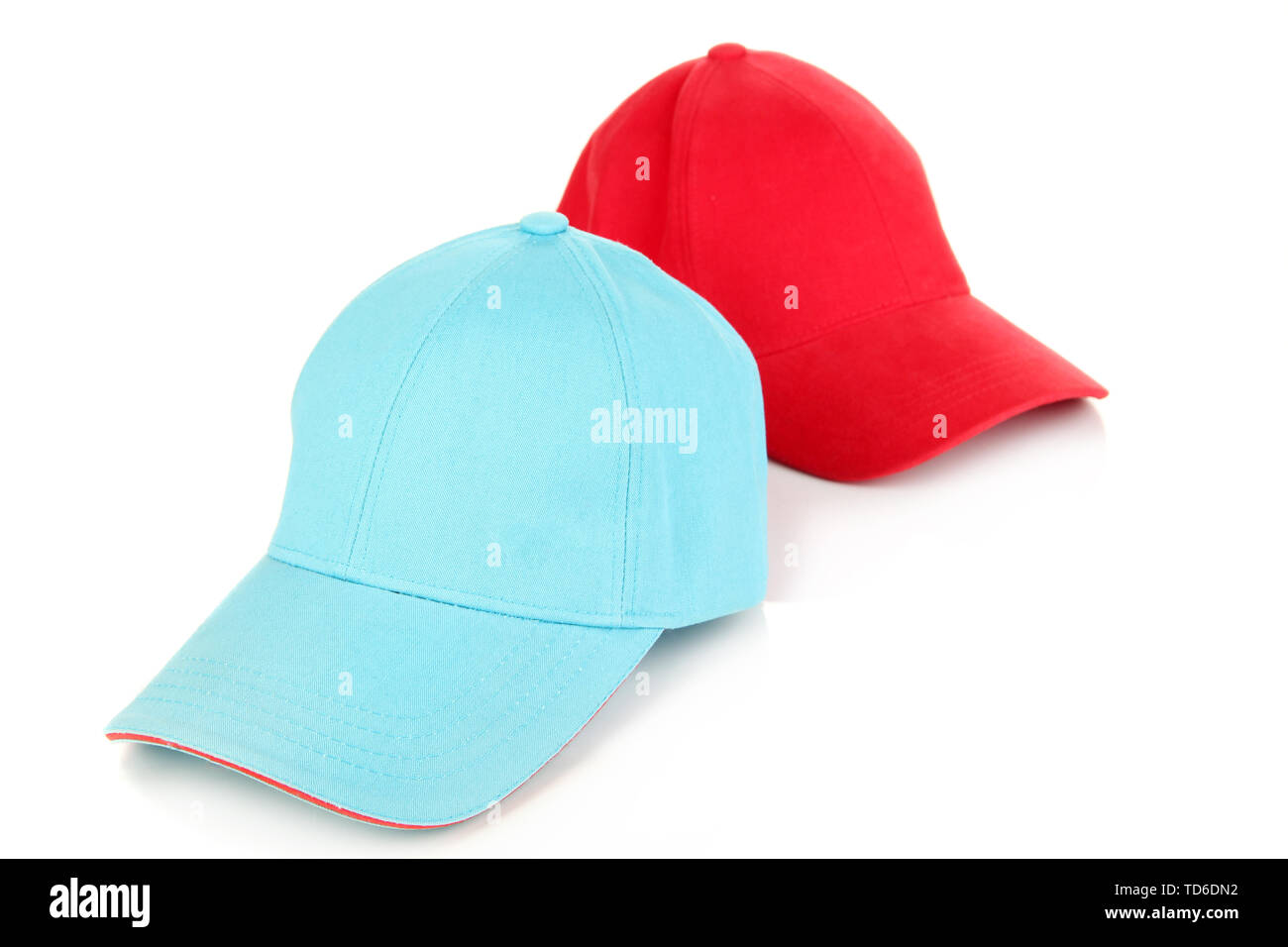 Red and blue caps cap isolated on white Stock Photo - Alamy