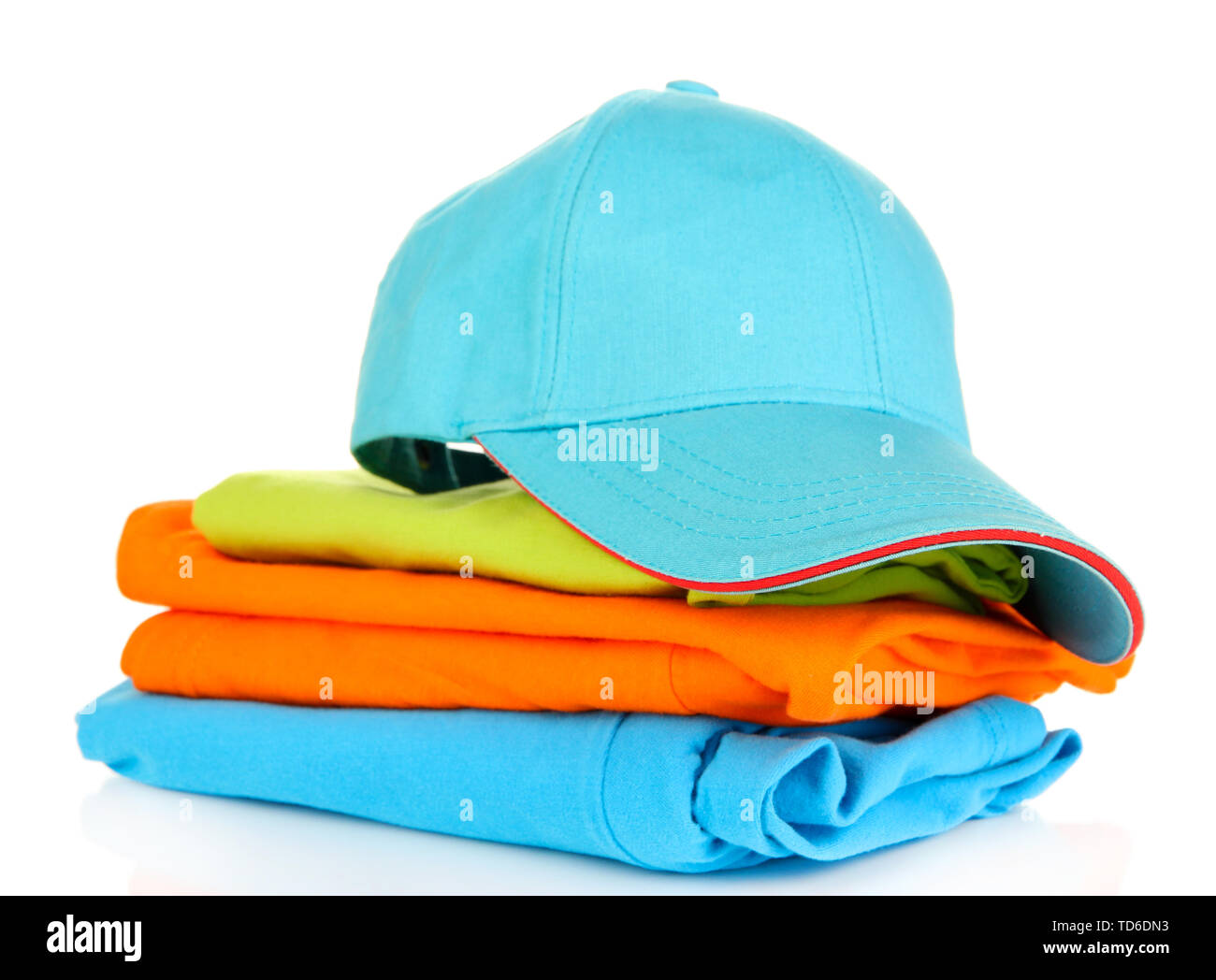 Blue peaked cap with T-shirts isolated on white Stock Photo - Alamy