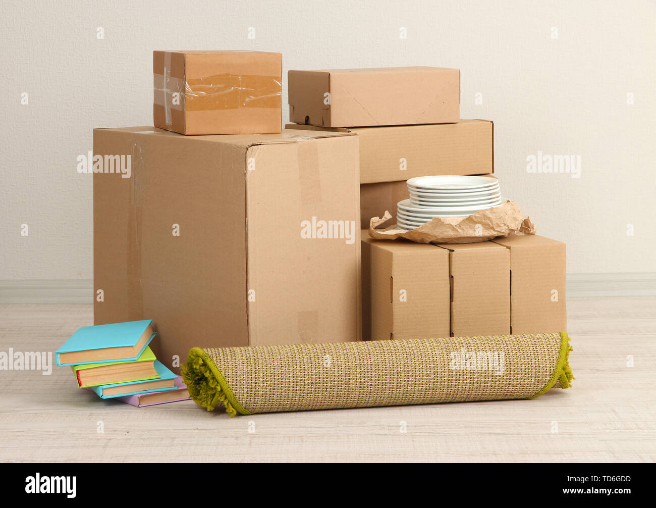 Moving boxes on the floor in empty room Stock Photo - Alamy