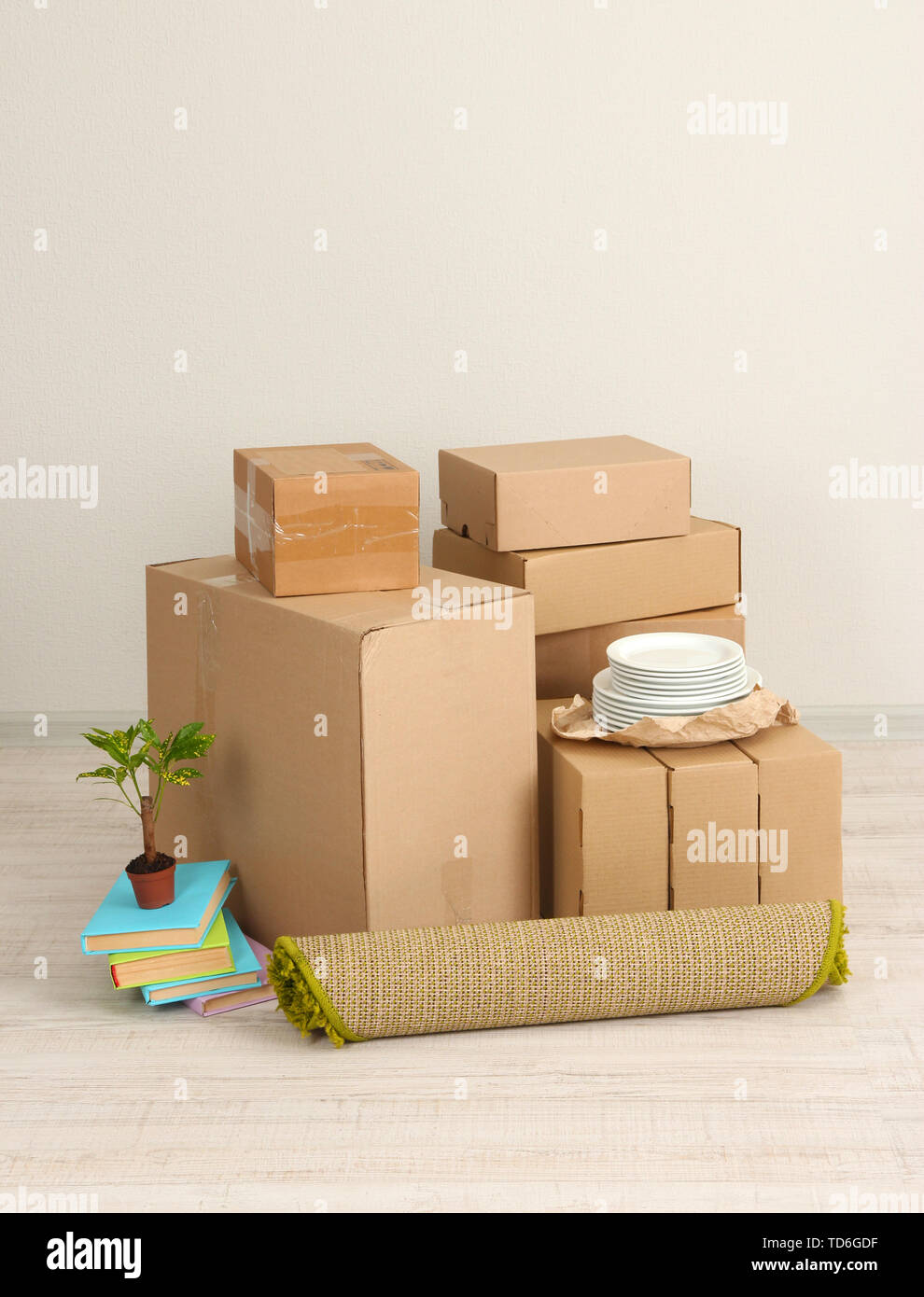 Moving boxes on the floor in empty room Stock Photo - Alamy