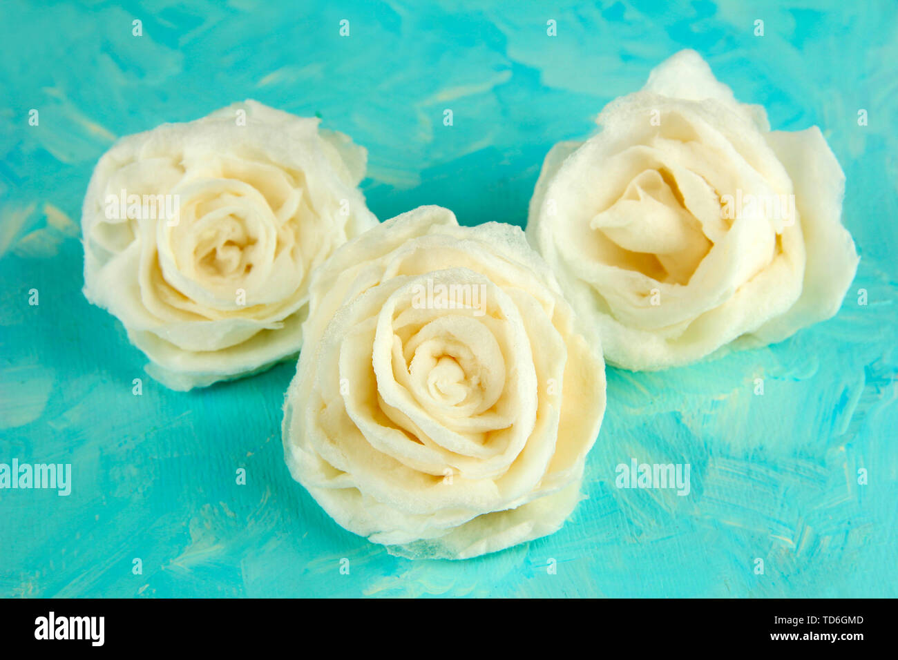 Sugar roses, on color background Stock Photo - Alamy