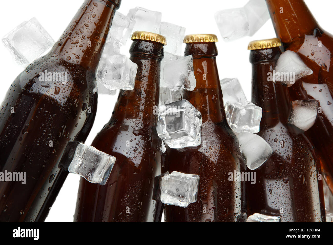 Beer bottles in ice cubes close up Stock Photo - Alamy