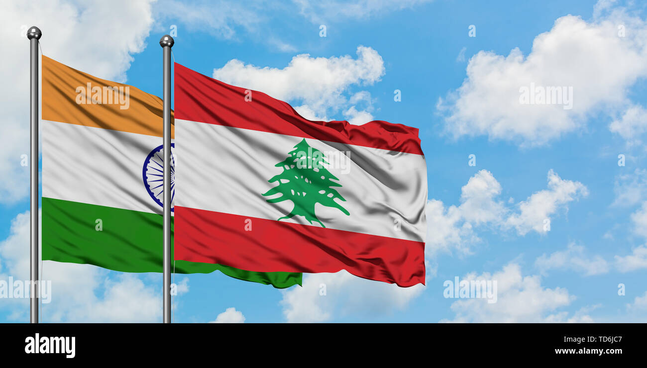 India and Lebanon flag waving in the wind against white cloudy blue sky ...