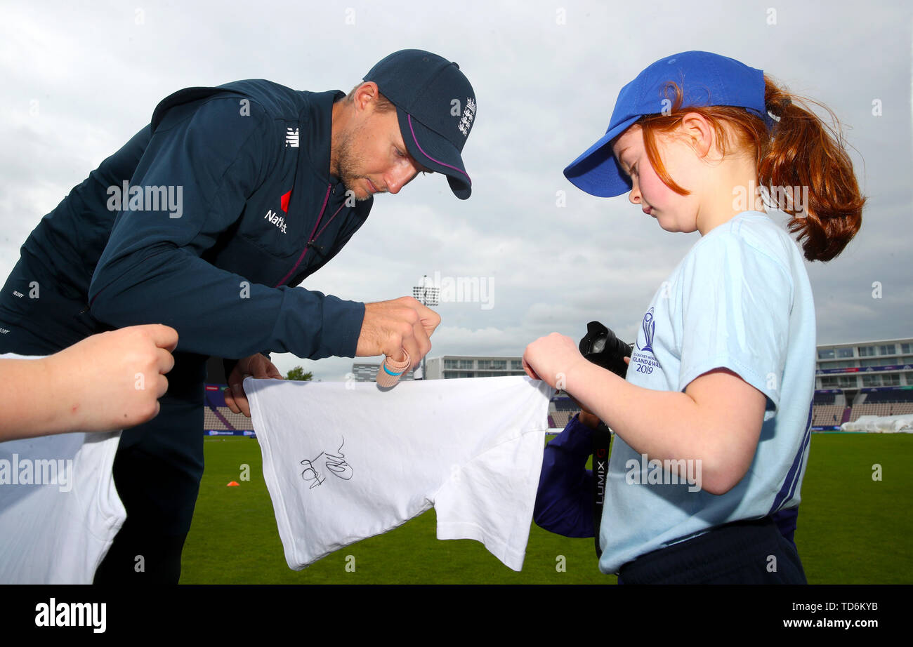 Engand's Joe Root signs an autograph for a fan during the nets session ...