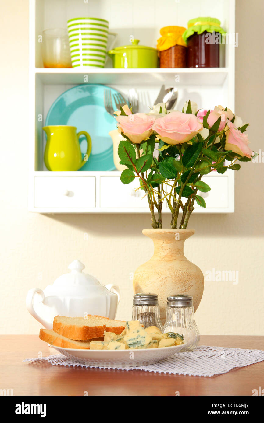 Kitchen composition on table on shelf background Stock Photo - Alamy
