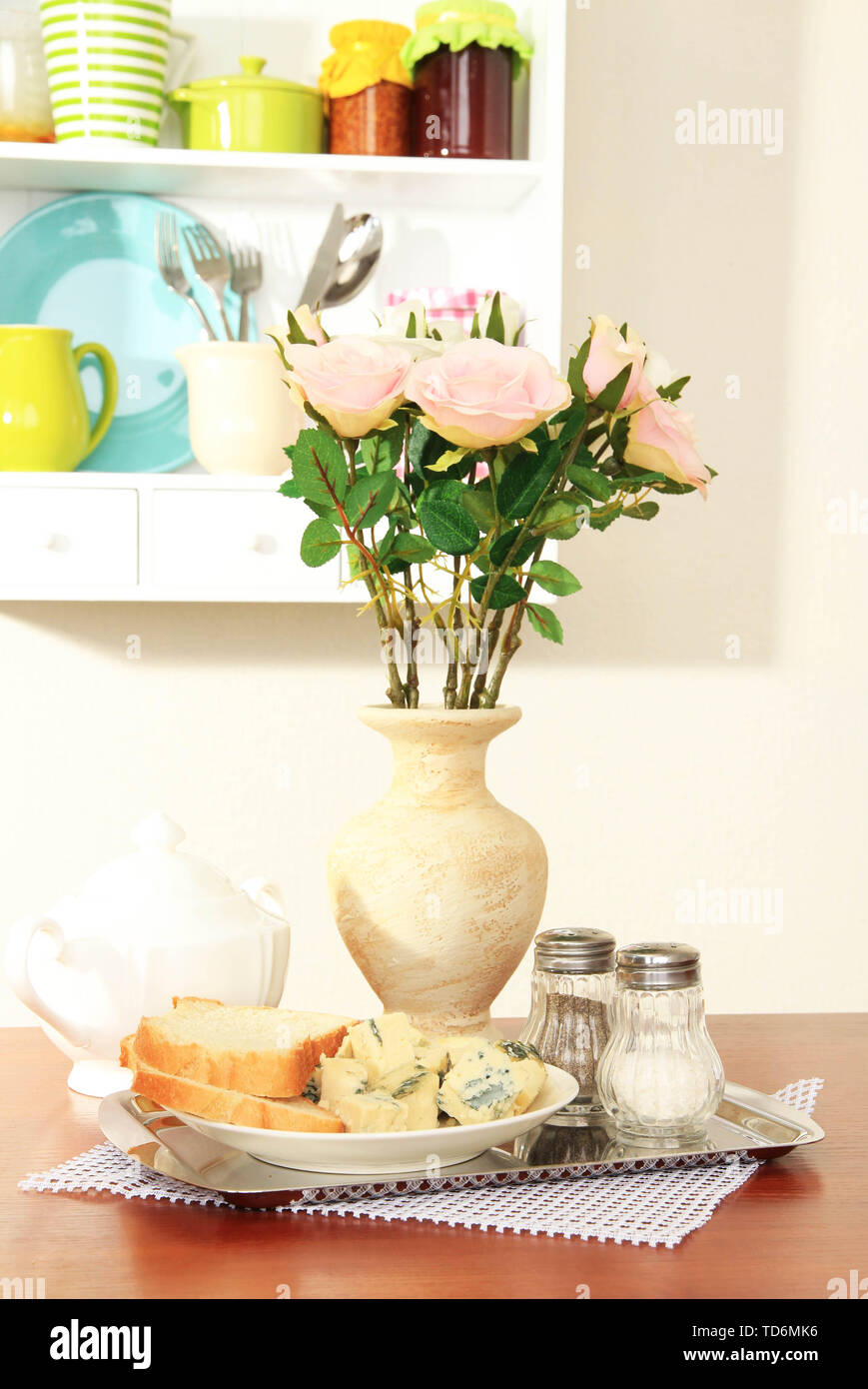 Kitchen composition on table on shelf background Stock Photo - Alamy