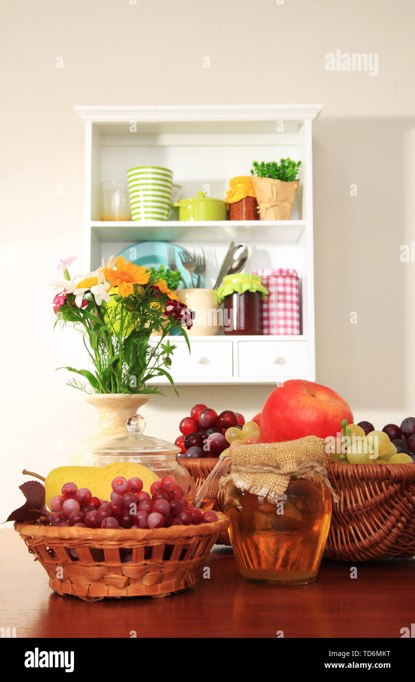 Kitchen composition on table on shelf background Stock Photo - Alamy