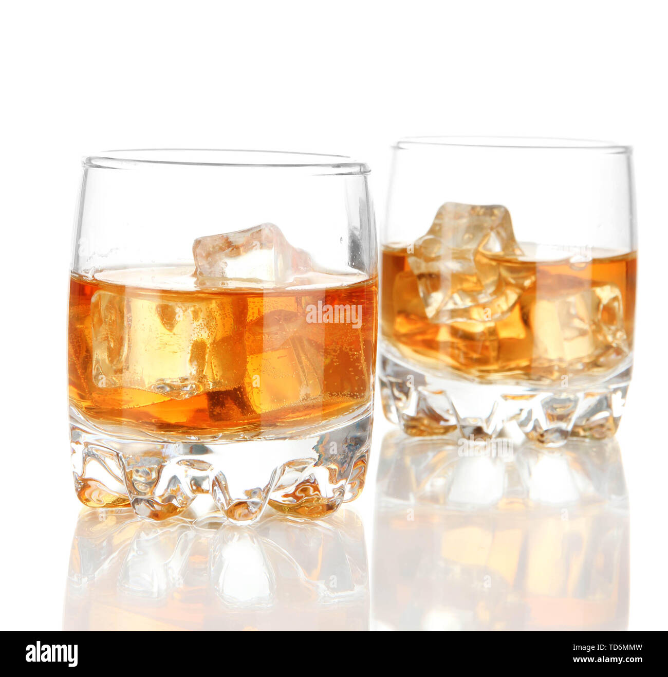 Brandy glasses with ice isolated on white Stock Photo - Alamy