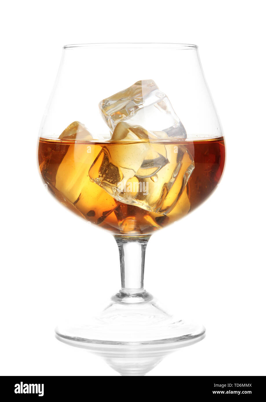 Brandy glass with ice isolated on white Stock Photo - Alamy
