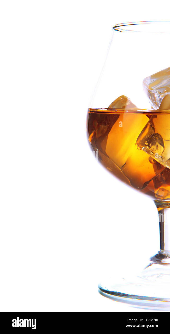 Brandy glass with ice isolated on white Stock Photo - Alamy