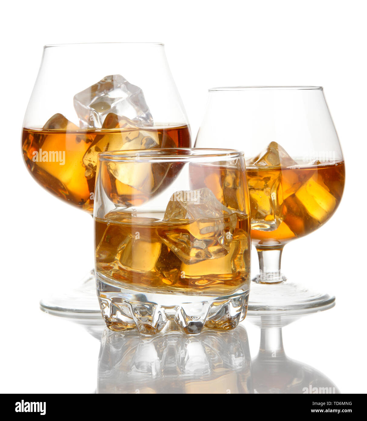 Brandy glasses with ice isolated on white Stock Photo - Alamy
