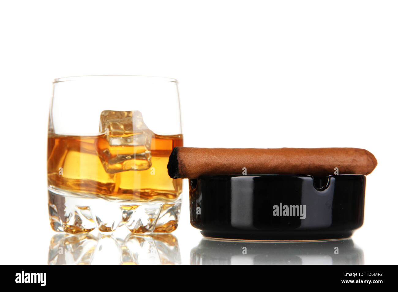 Brandy glass with ice and cigar isolated on white Stock Photo - Alamy