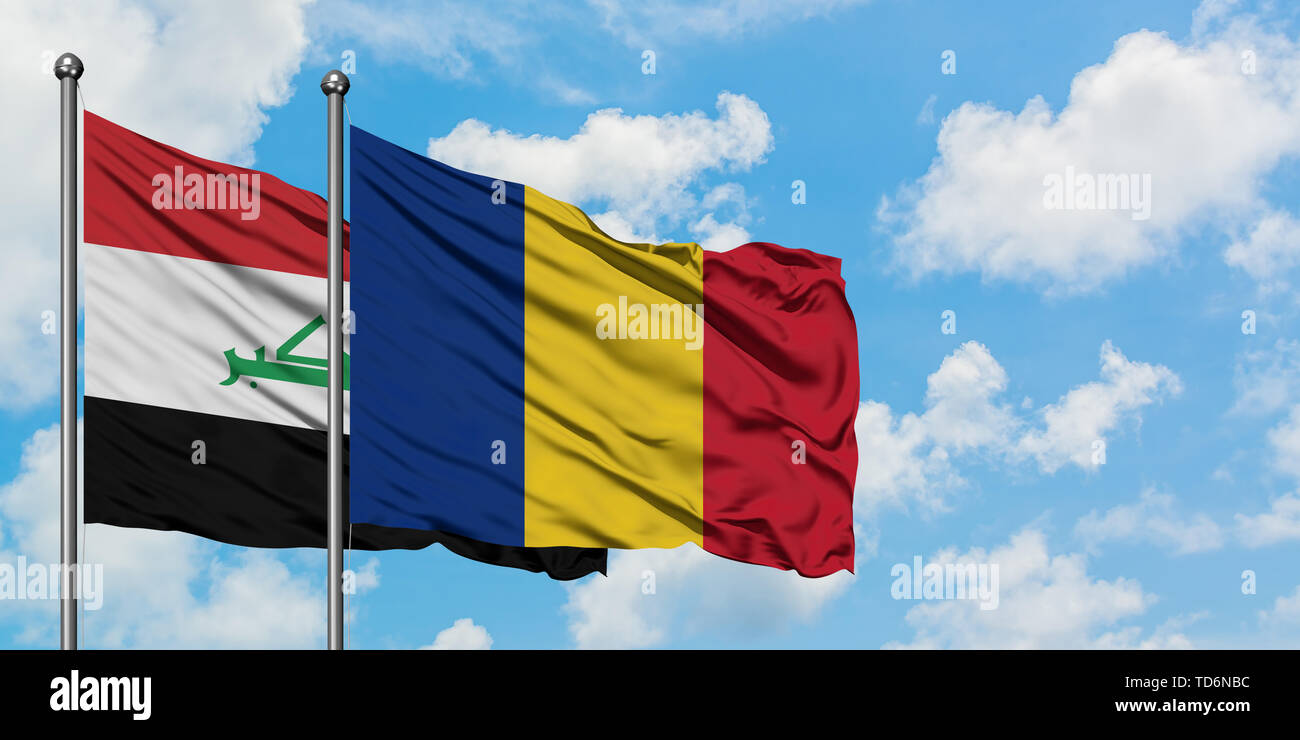 Iraq and Romania flag waving in the wind against white cloudy blue sky ...
