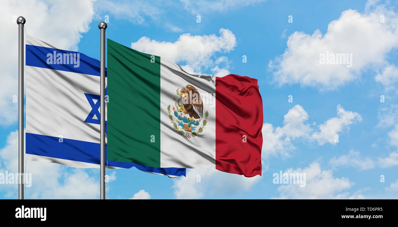 Israel and Mexico flag waving in the wind against white cloudy blue sky ...