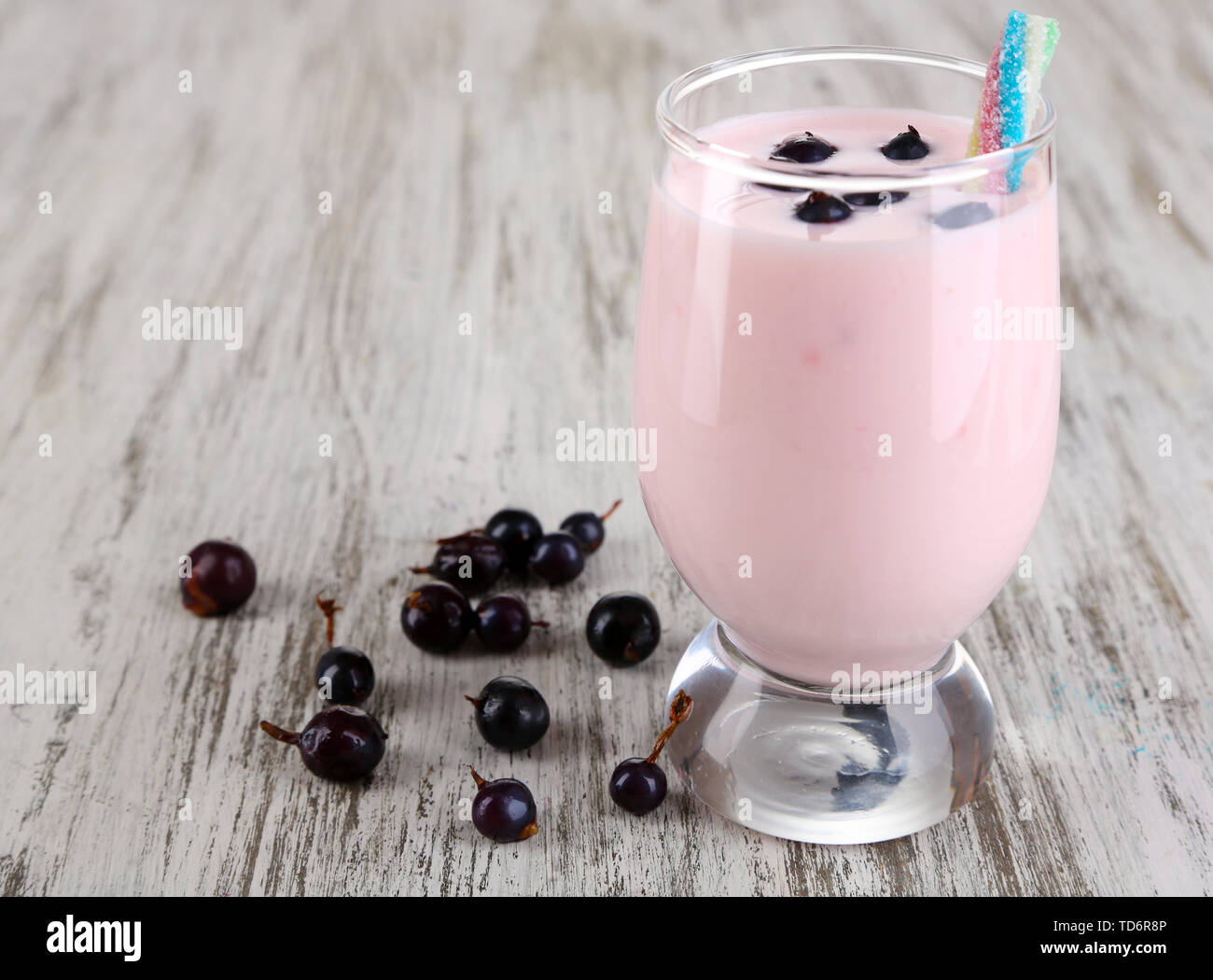 Delicious milk shake with blackberry on wooden table close-up Stock ...