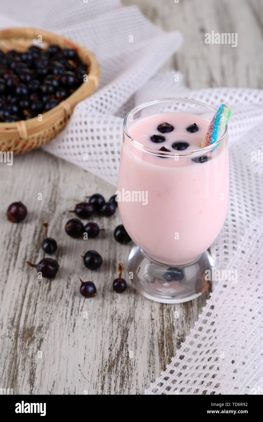 Delicious milk shake with blackberry on wooden table close-up Stock ...