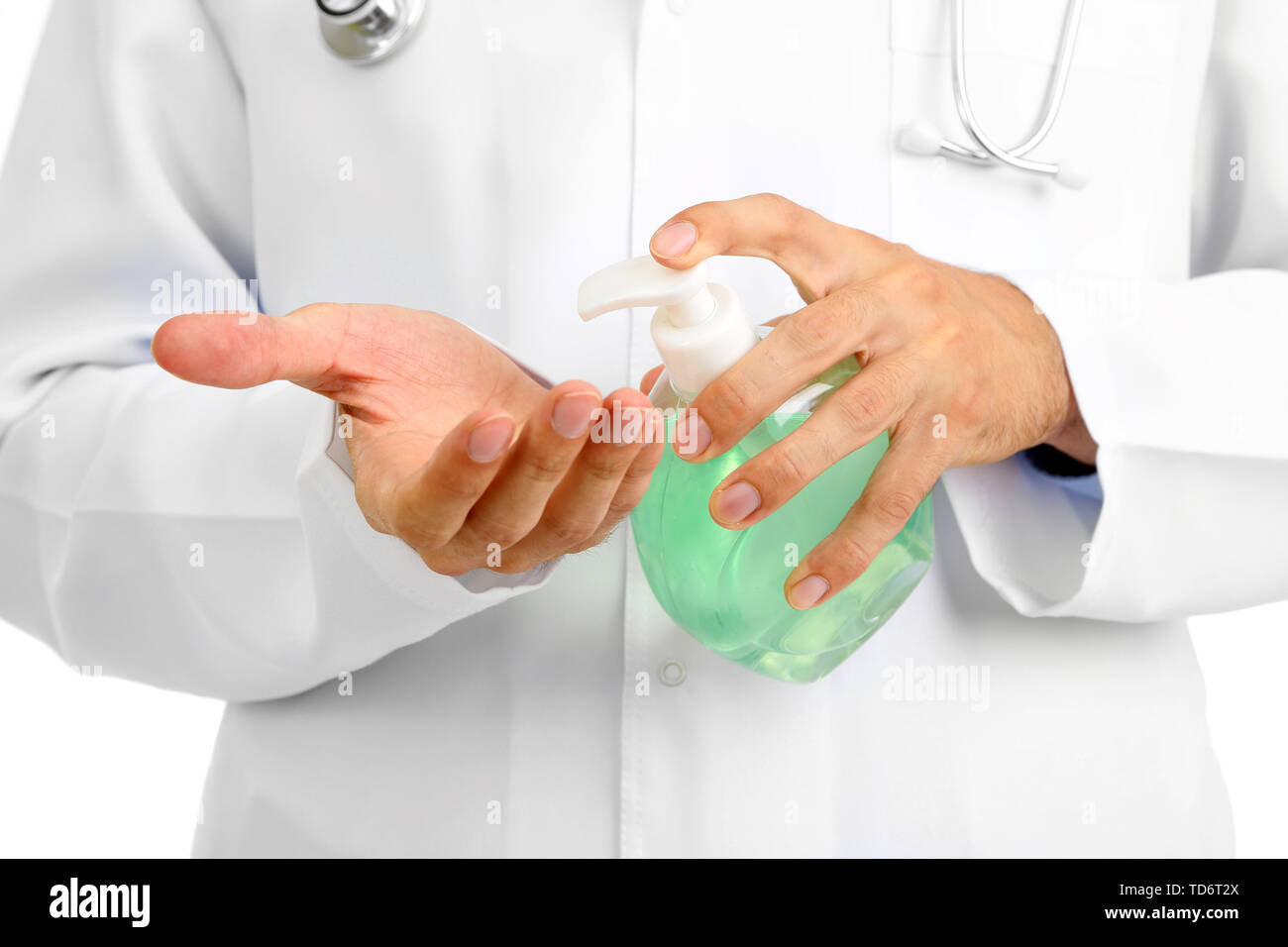 Medical doctor using sanitizer dispenser Stock Photo - Alamy