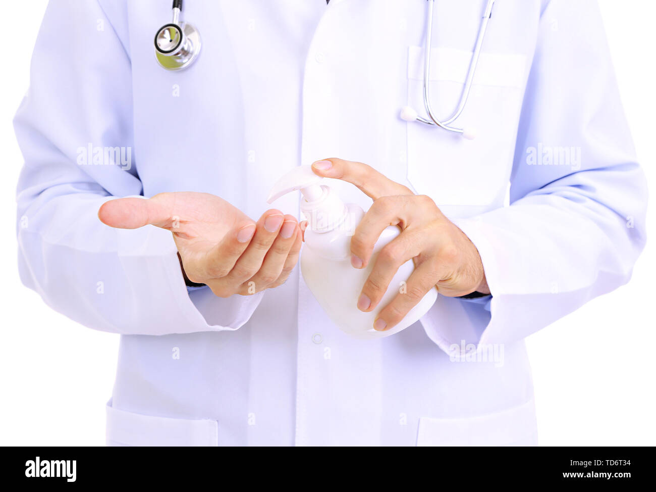 Medical doctor using sanitizer dispenser Stock Photo - Alamy