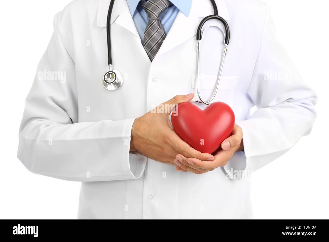 Medical doctor holding heart isolated on white Stock Photo - Alamy