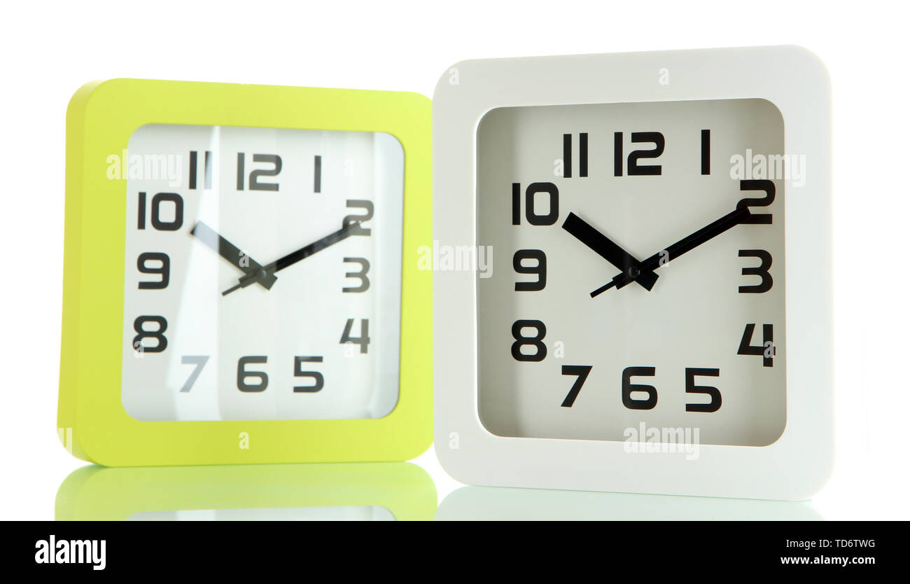 Two office clocks, isolated on white Stock Photo - Alamy