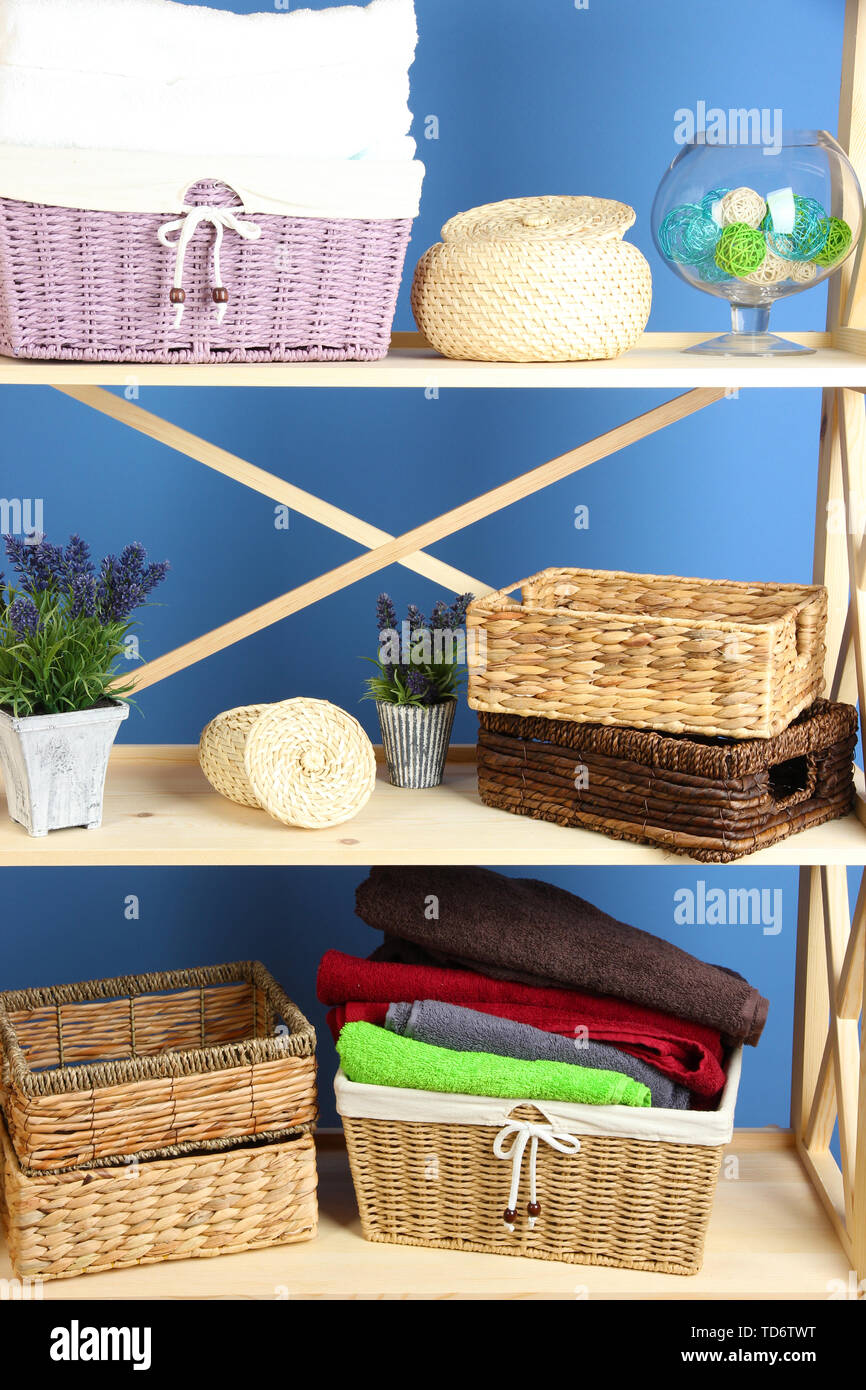 Beautiful white shelves with different home related objects, on color ...