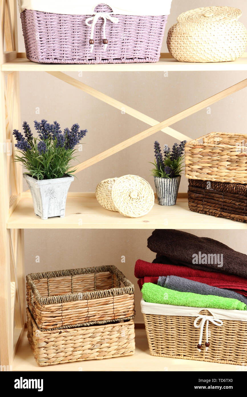 Beautiful white shelves with different home related objects, on color ...