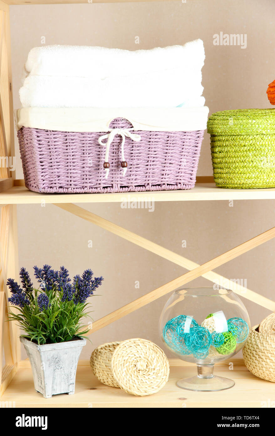 Beautiful white shelves with different home related objects, on color ...