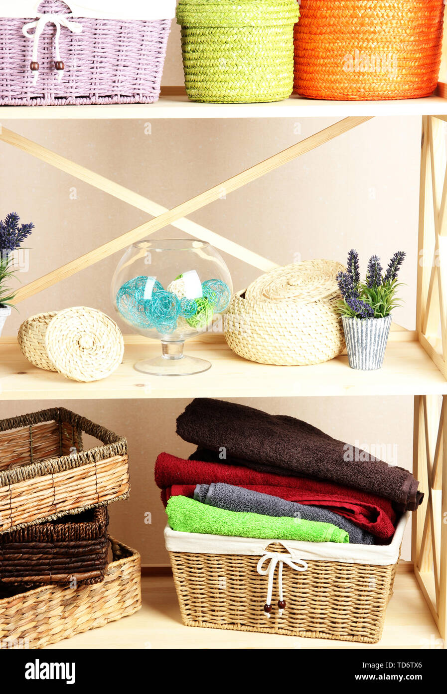 Beautiful white shelves with different home related objects, on color ...