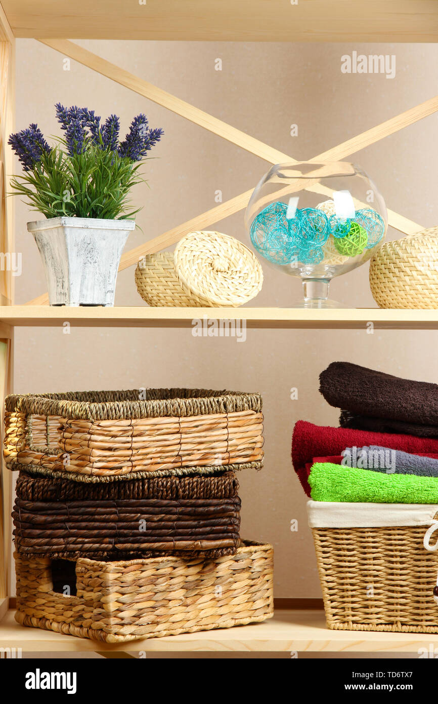 Beautiful white shelves with different home related objects, on color ...