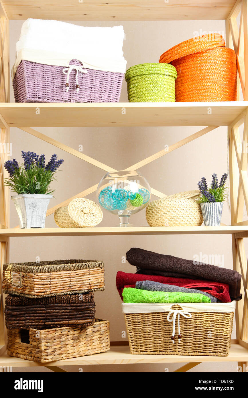 Beautiful white shelves with different home related objects, on color ...