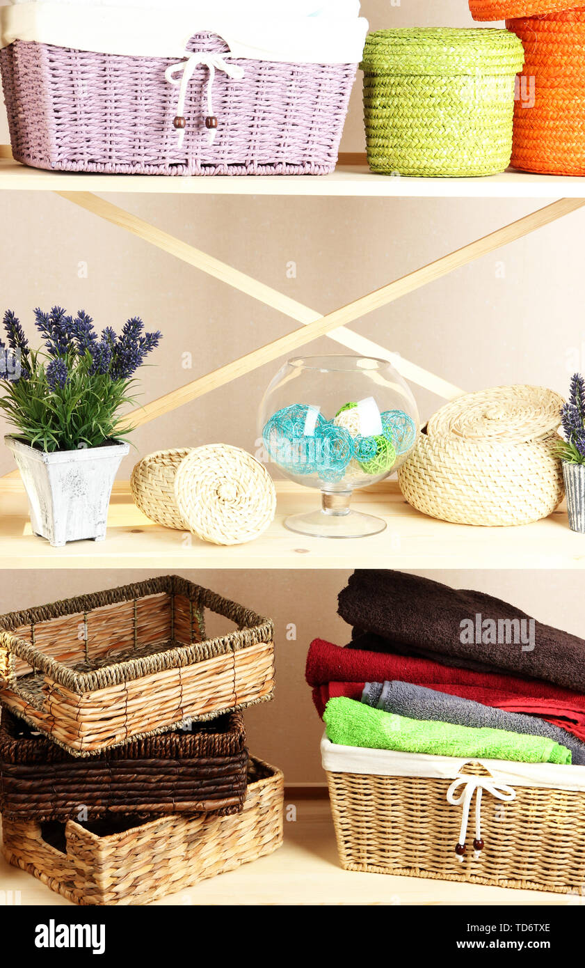 Beautiful white shelves with different home related objects, on color ...