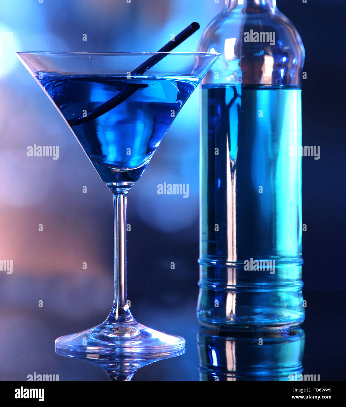 Glass of cocktail on bright background Stock Photo - Alamy