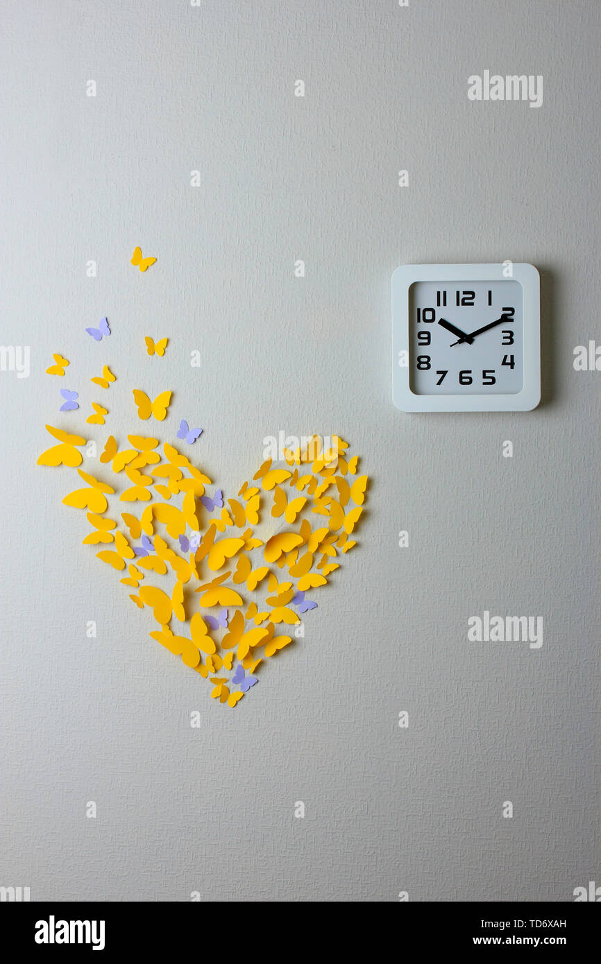 Office clock on color wall background Stock Photo - Alamy