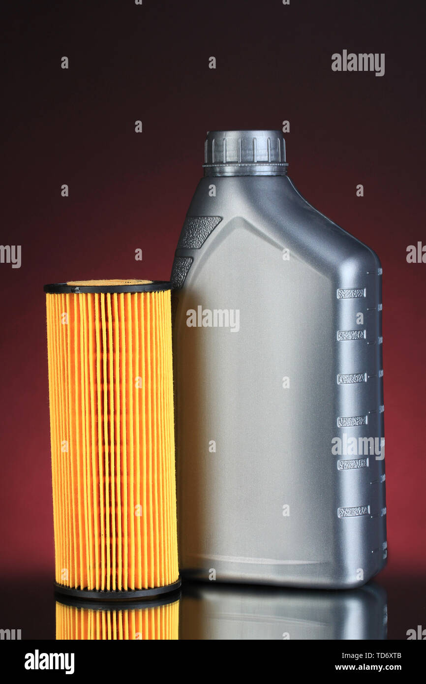 Car oil filter and motor oil can on dark color background Stock Photo ...