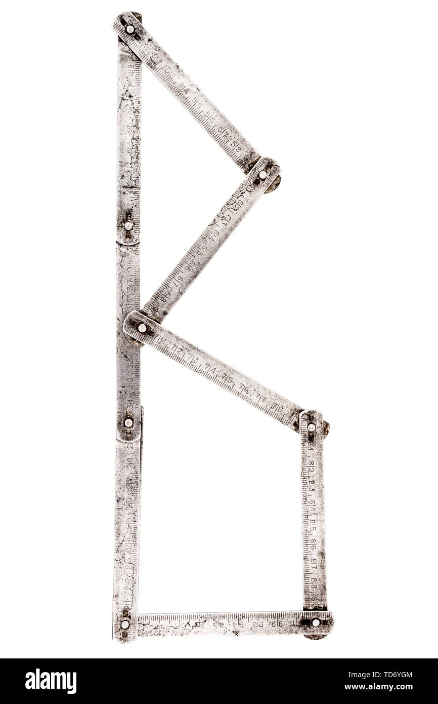 Old iron meter ruler. Old iron folding meter in the shape of letter B ...