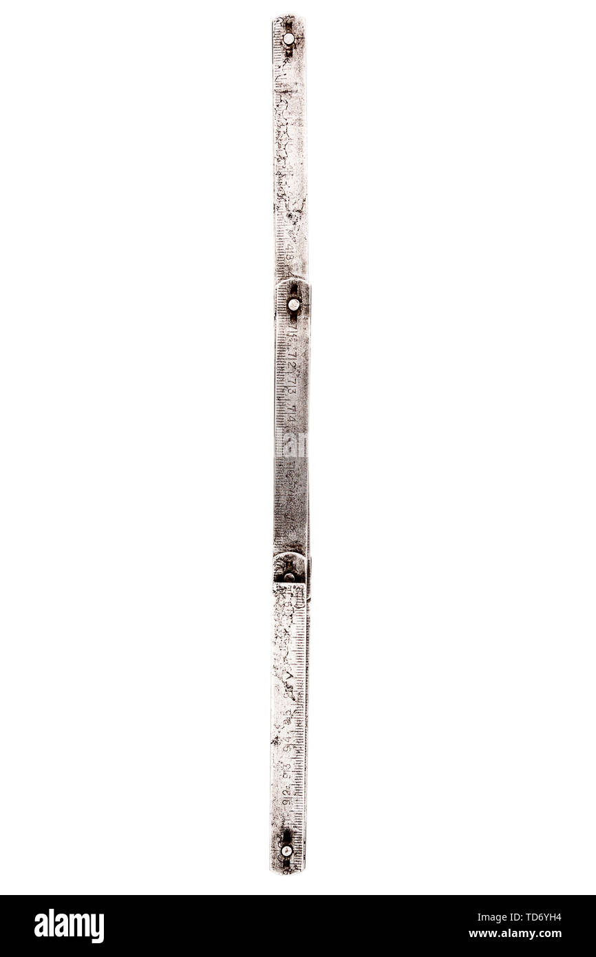 Old iron meter ruler. Old iron folding meter in the shape of letter I ...