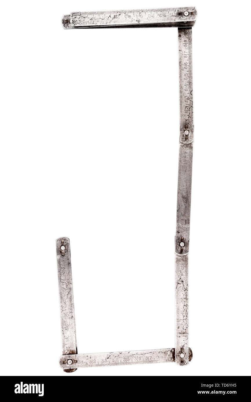 Old iron meter ruler. Old iron folding meter in the shape of letter J ...